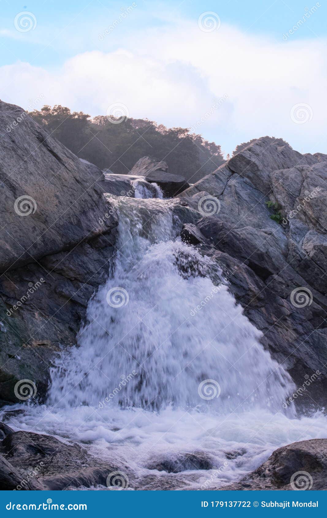 A Small Waterfall Failing Down between the Rocks Downhill Stock Photo ...