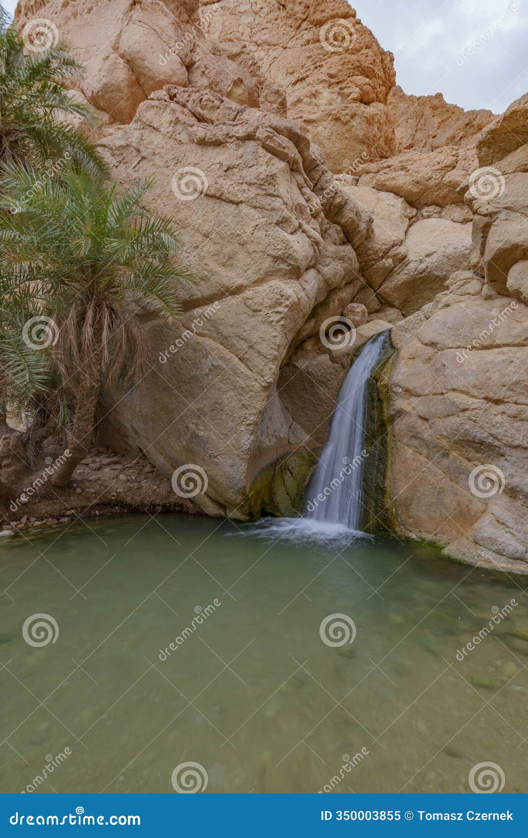 A Small Waterfall Hidden between Rocks in the Desert Stock Image ...