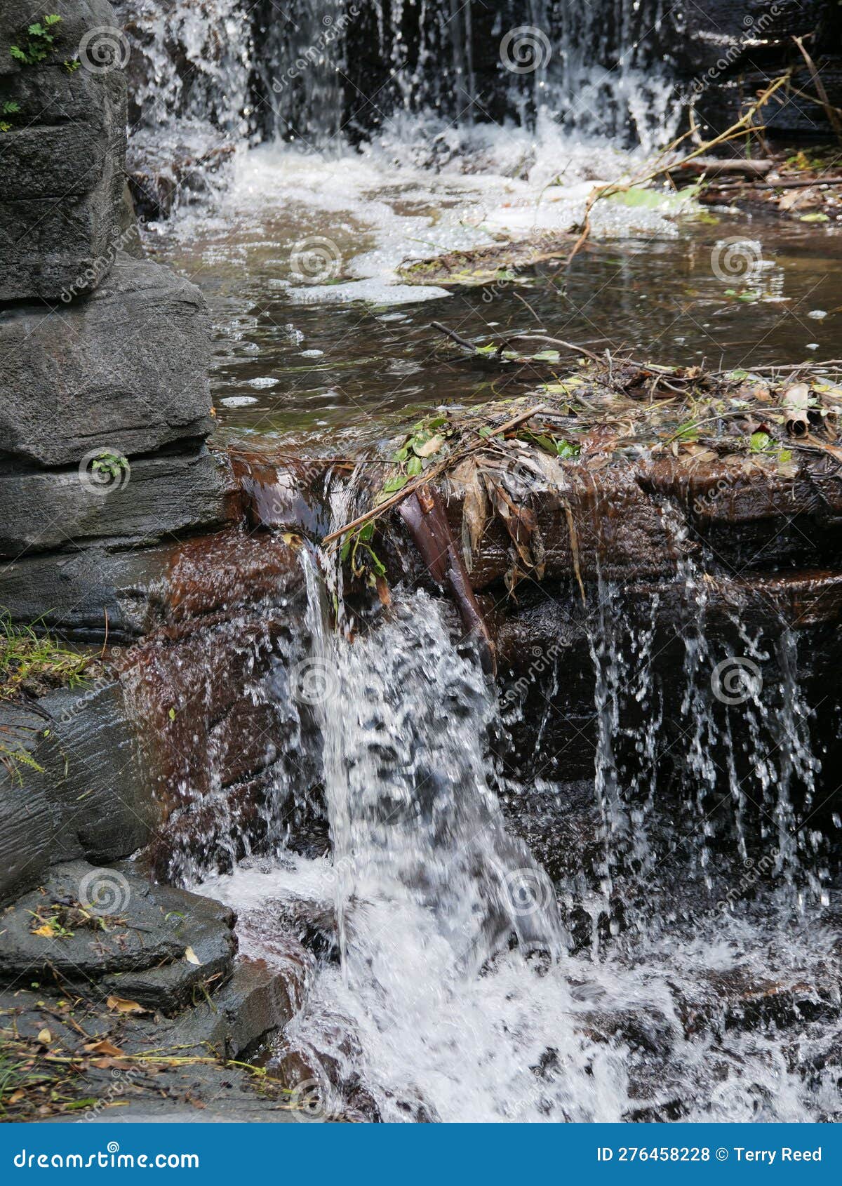 A Small Waterfall that Flows Over Rocks Stock Photo - Image of ...