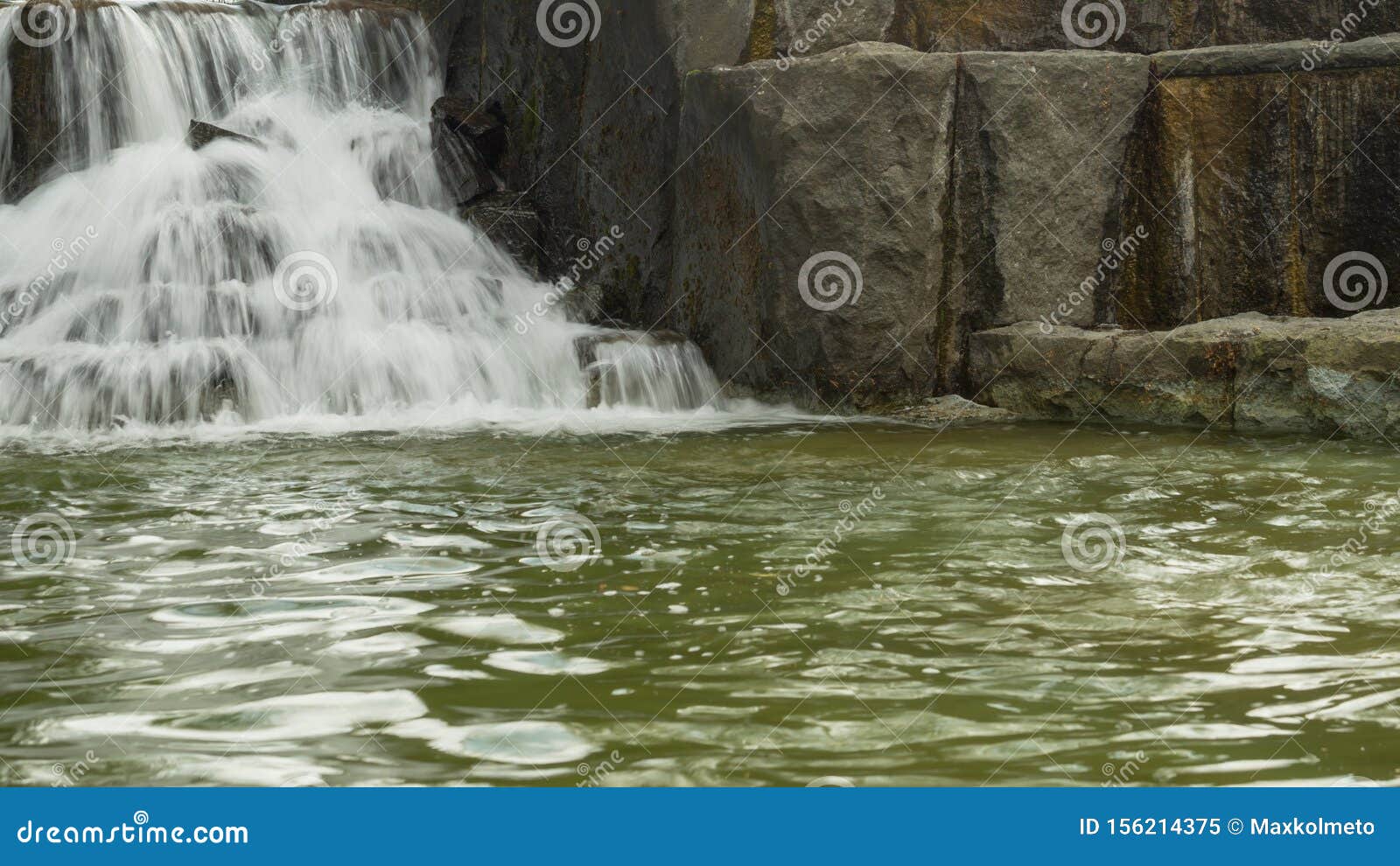 Small Waterfall Flows into a Pond. Rushing Stream Water Stock Image ...