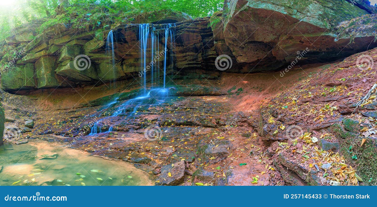 Small Waterfall in the Forest Cascading with Foliage at the Bottom ...