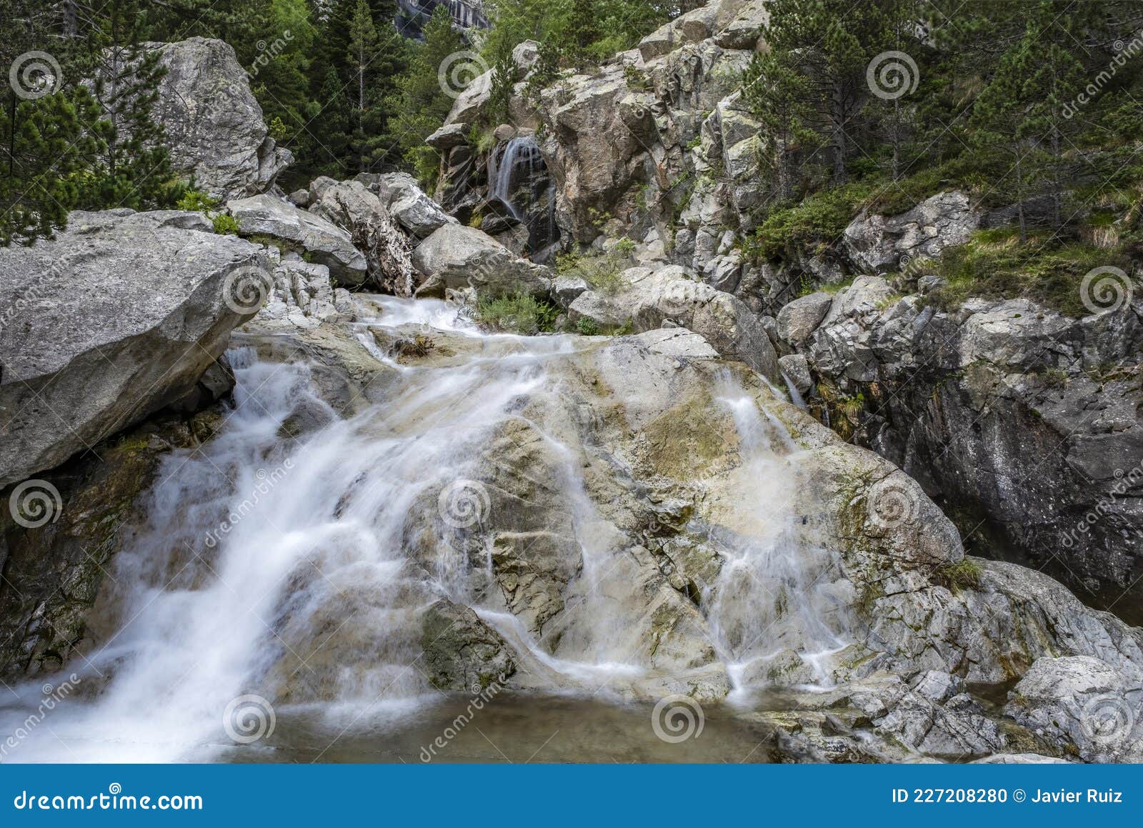 Small Waterfall in a High Mountain River Running between Rocks Stock ...