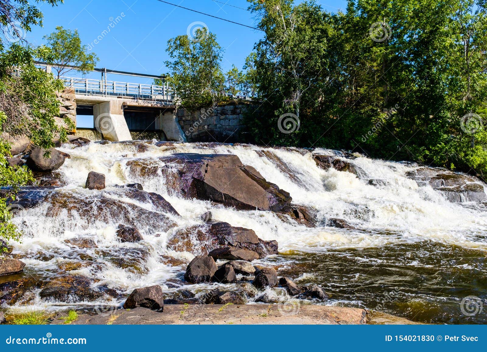 Small Waterfall by a Highway Bridge Stock Photo - Image of waterfall ...