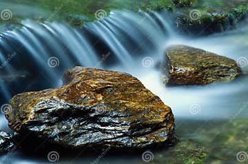 Small Waterfall and a Pair of River Rocks Stock Image - Image of rivers ...