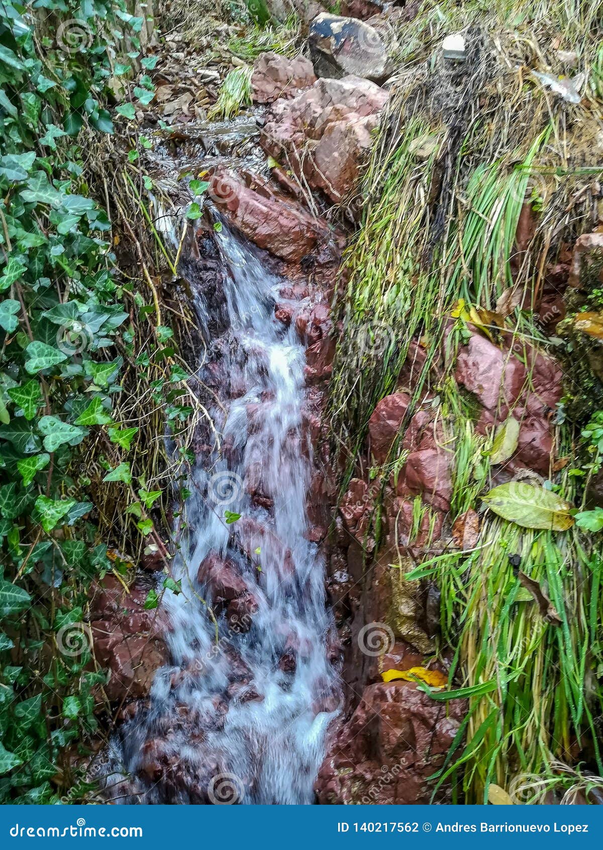 Small Waterfall with Reddish Rocks Stock Photo - Image of outdoors ...