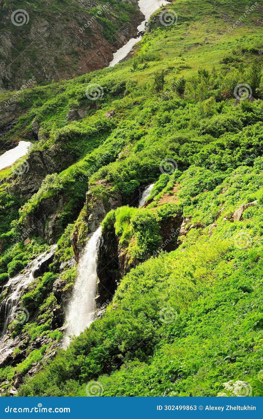 A Small Waterfall in a Stormy Stream Flowing Down from a High Cliff ...