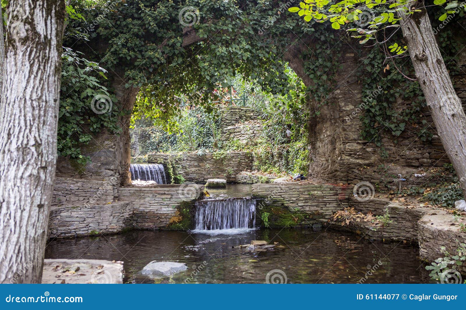 Small Waterfall Under Stone Arch Stock Image - Image of water, covered ...