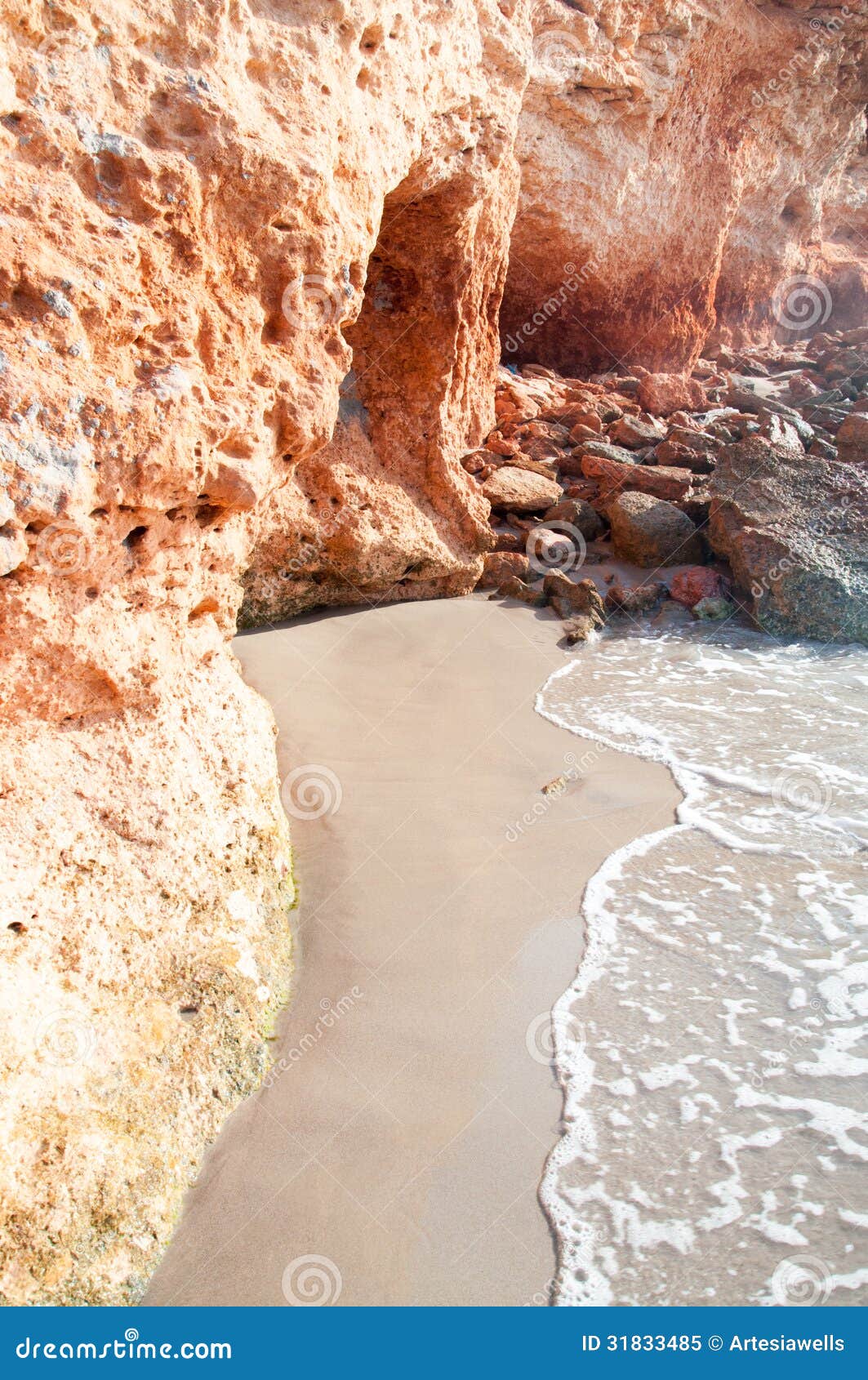 Small wave meets red rock stock image. Image of water - 31833485