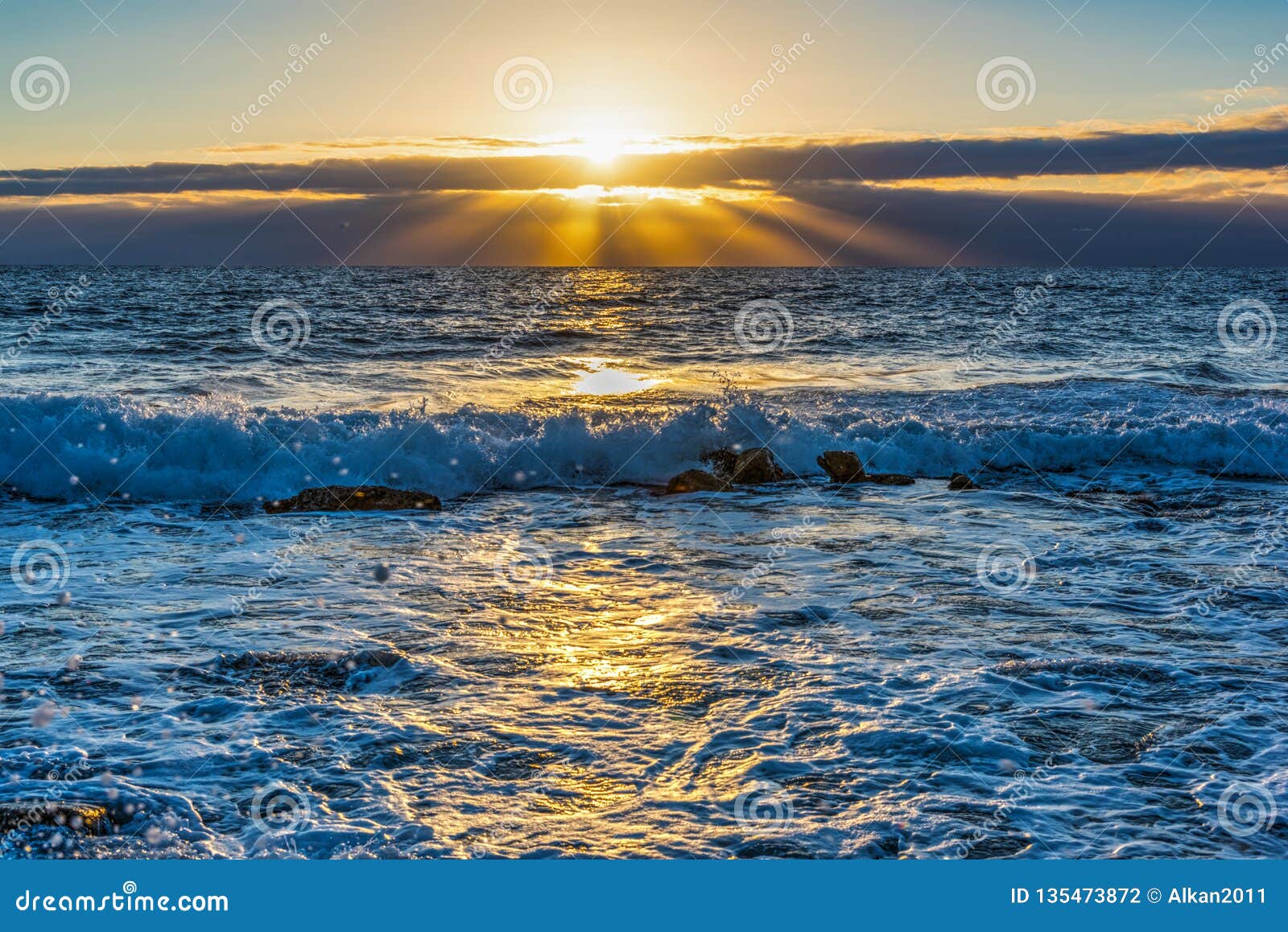 Small Wave Under a Shining Sun at Sunset Stock Photo - Image of dusk ...