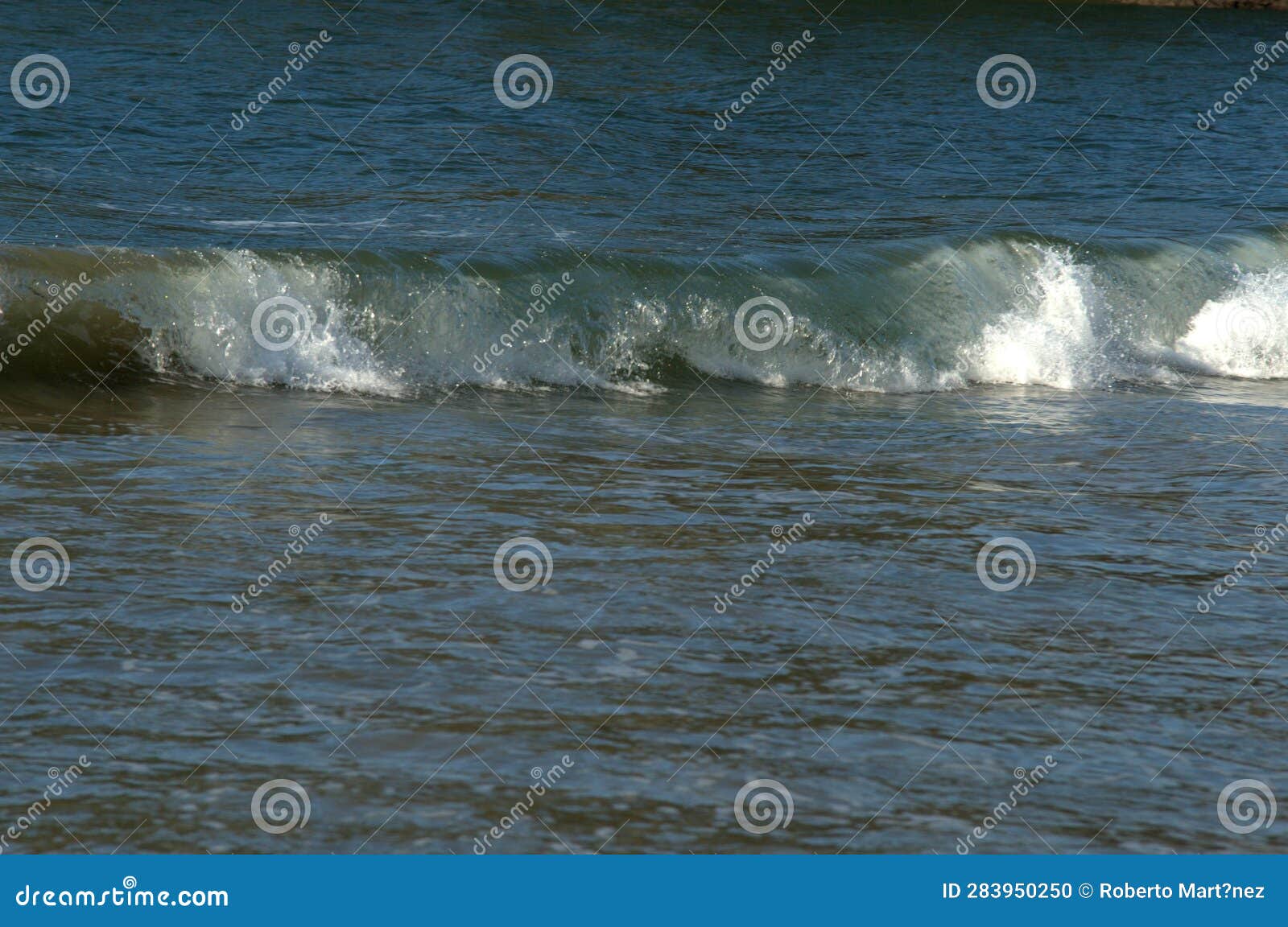 Small Waves of the Atlantic Ocean Breaking on the Coast Stock Photo ...