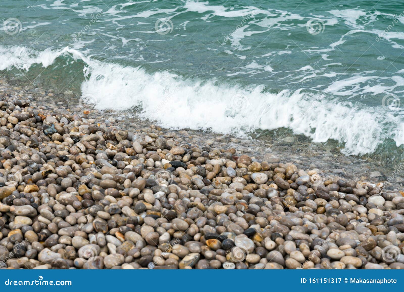 Waves Crash Onto a Rock and Pebble Beach Stock Image - Image of crash ...