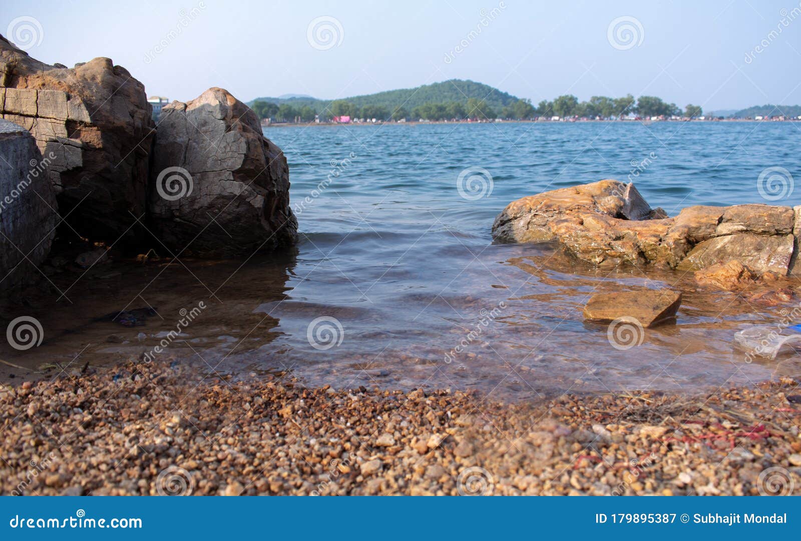 Small Waves in a Lake Meeting the Shore Captured from Low Angle Stock ...