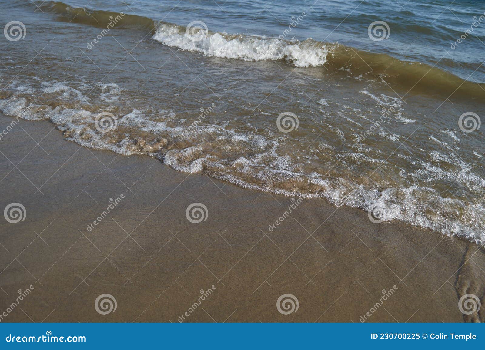 Small Waves Roll in on Sand of Riverside Beach Stock Image - Image of ...