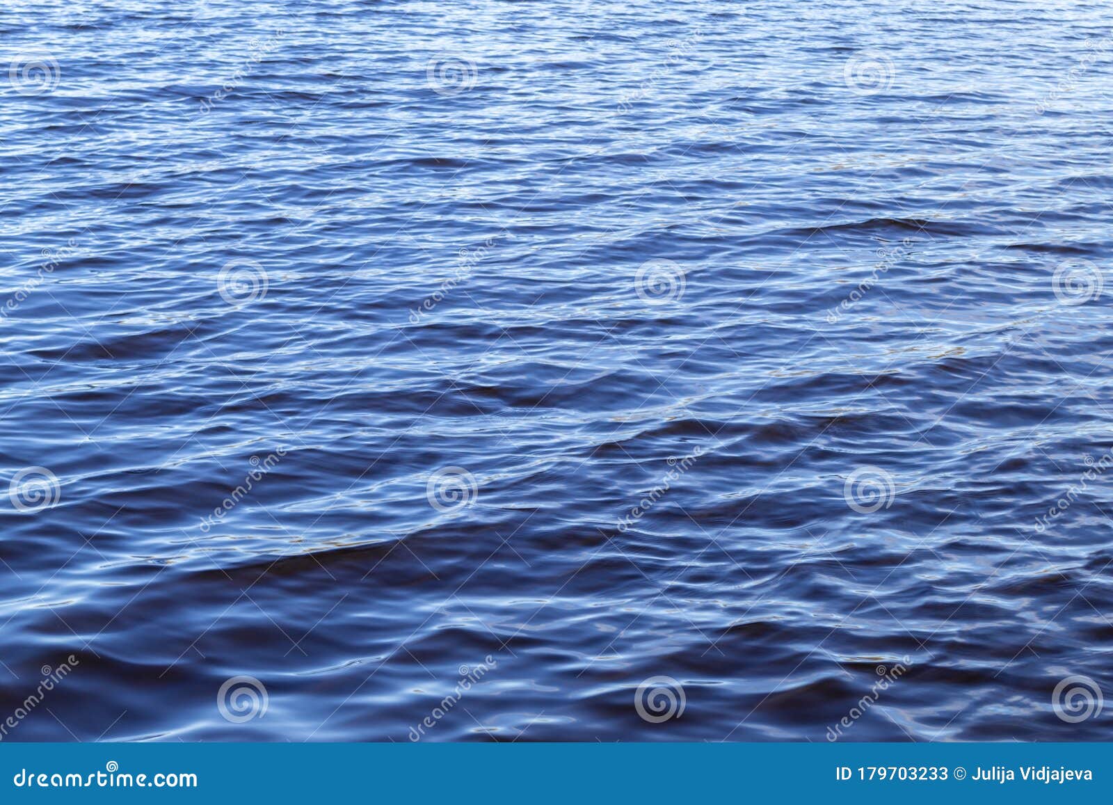 Small Waves on the Surface of the Lake. Beautiful Texture of Blue Water ...