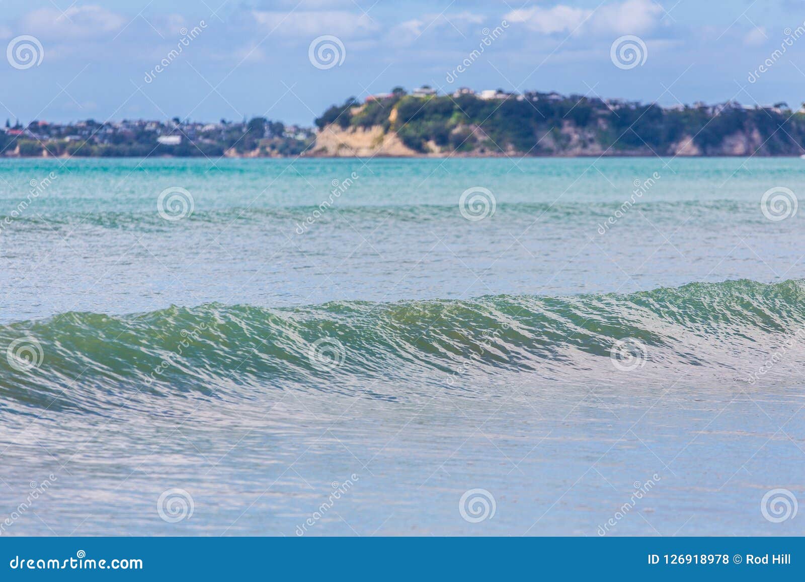 Waves roll into the beach stock photo. Image of continuously - 126918978