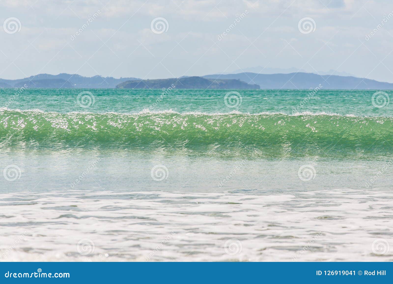 Waves roll into the beach stock image. Image of small - 126919041