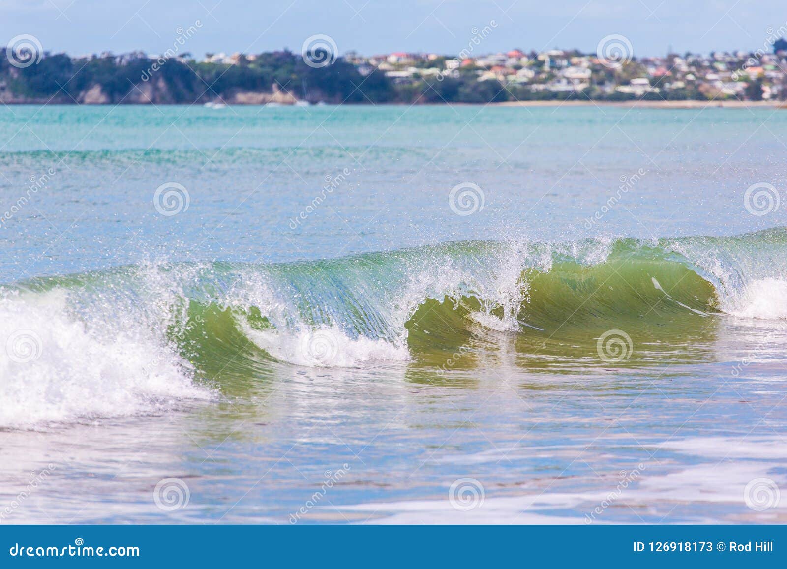 Waves roll into the beach stock image. Image of seascape - 126918173