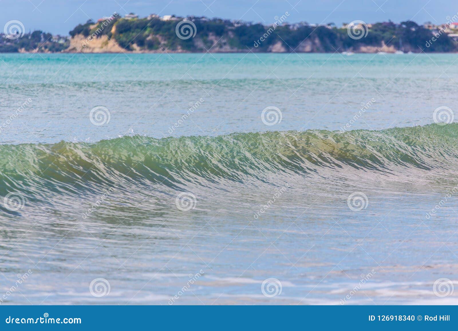 Waves roll into the beach stock photo. Image of continuously - 126918340