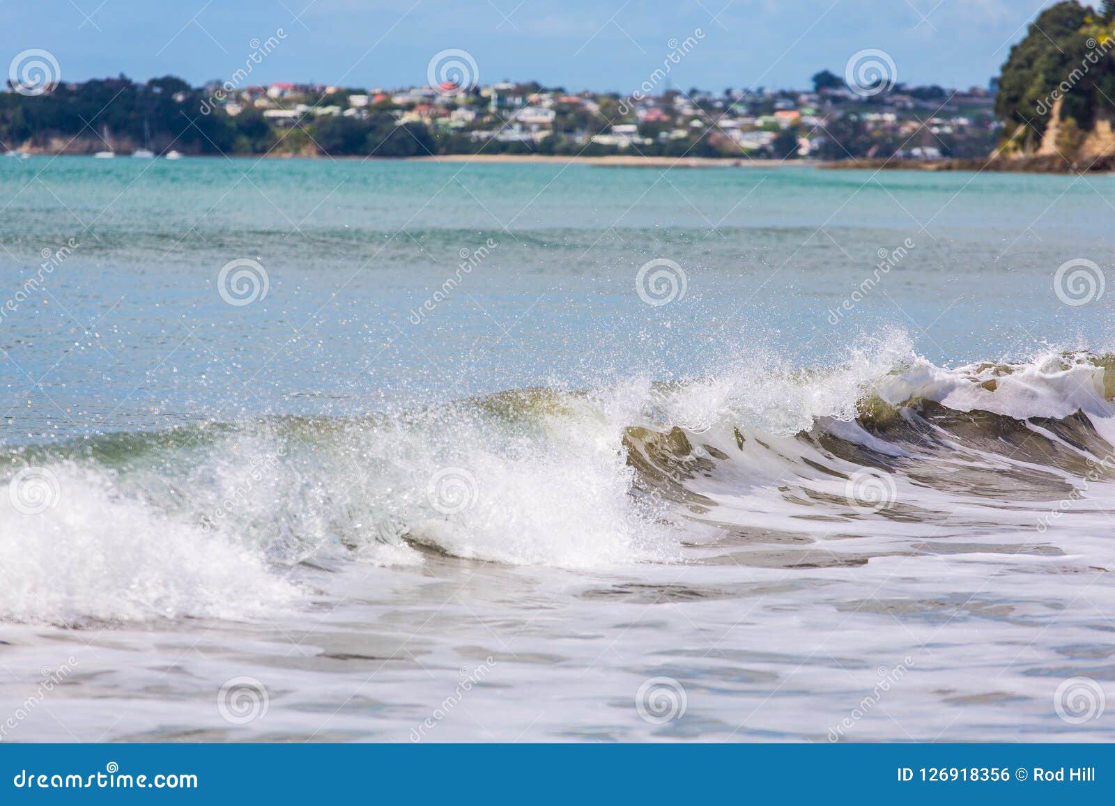 Waves roll into the beach stock photo. Image of small - 126918356