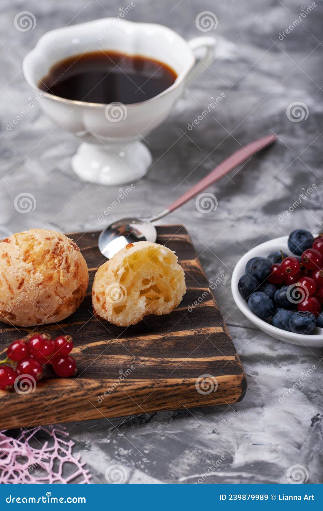 Small White Buns with Fresh Berries with Cup of Coffee on a Concrete ...