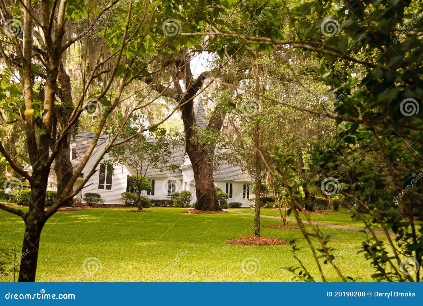 Small White Church through Trees and Green Lawn Stock Photo - Image of ...
