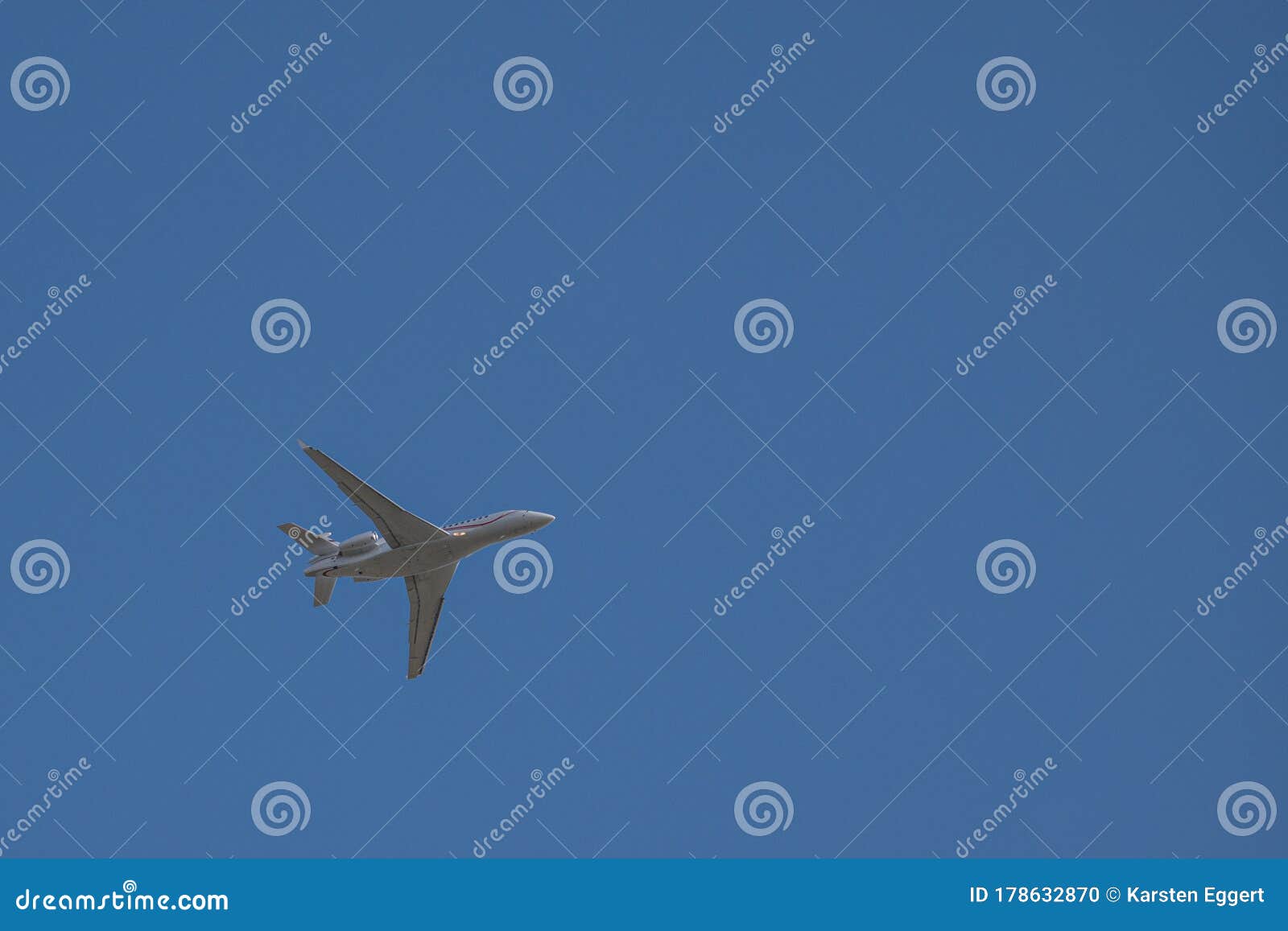 Small White Jet Airplane Flies in the Blue almost Cloudless Sky Stock ...