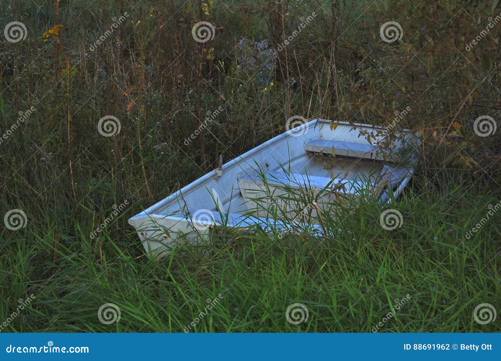 White Rowboat Floating On Clear, Calm Blue Water With Gentle Ripples ...