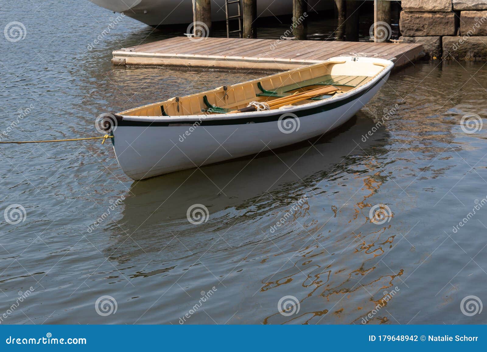 White Rowboat Floating On Clear, Calm Blue Water With Gentle Ripples ...