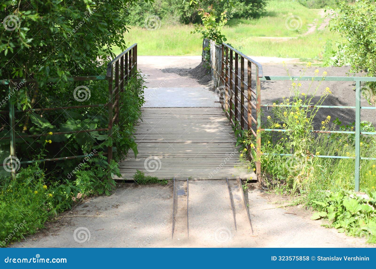 Small Wooden Bridge with a Metal Railing Stock Photo - Image of area ...