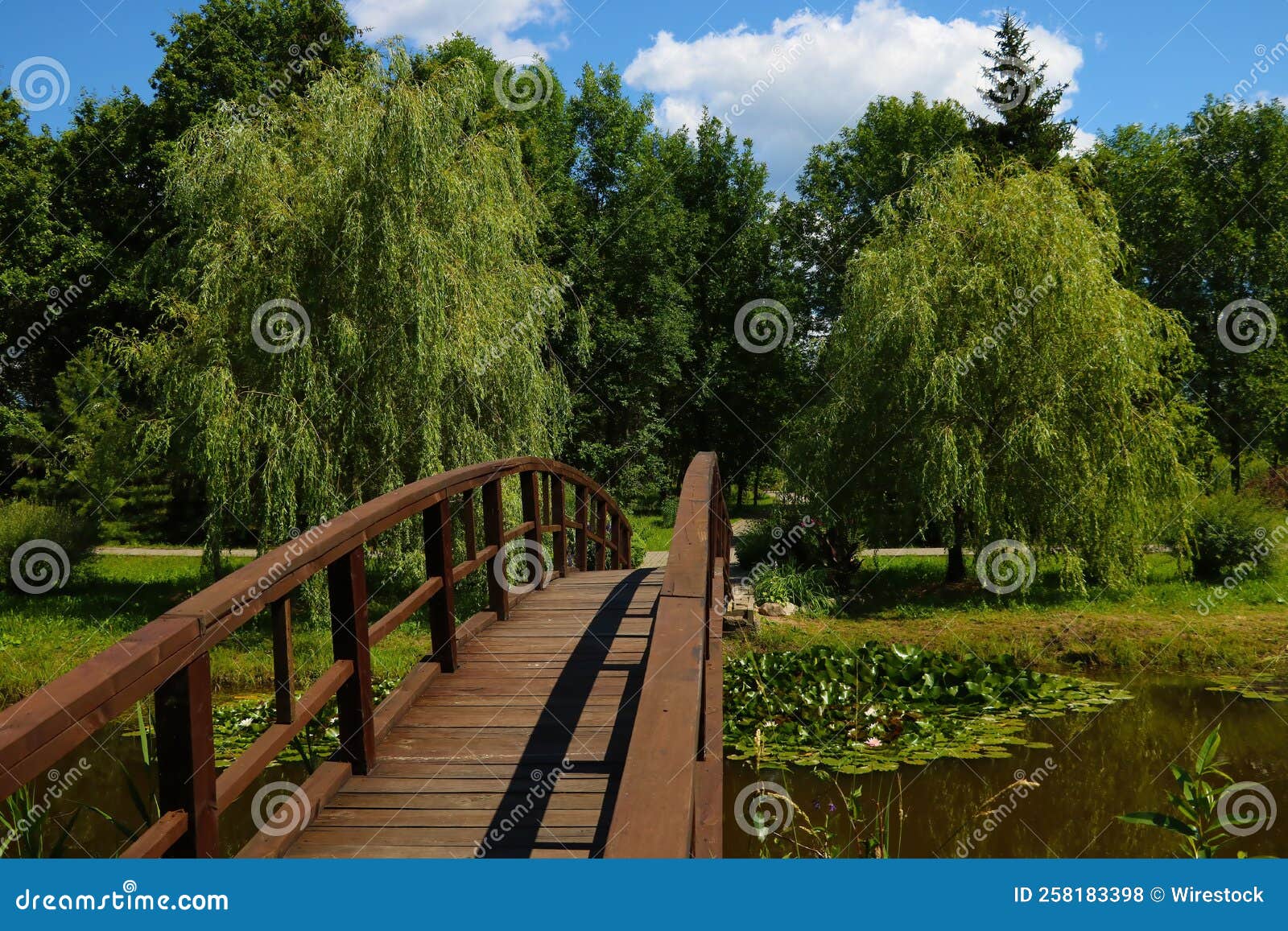 Small Wooden Bridge Over a Lake Stock Photo - Image of park, bridge ...