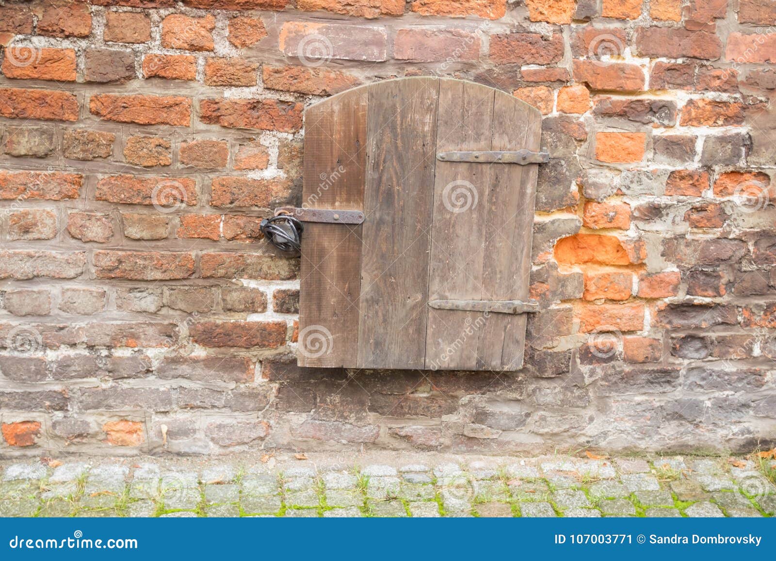 Small Wooden Door with Lock in Stone Wall Stock Image - Image of brick ...