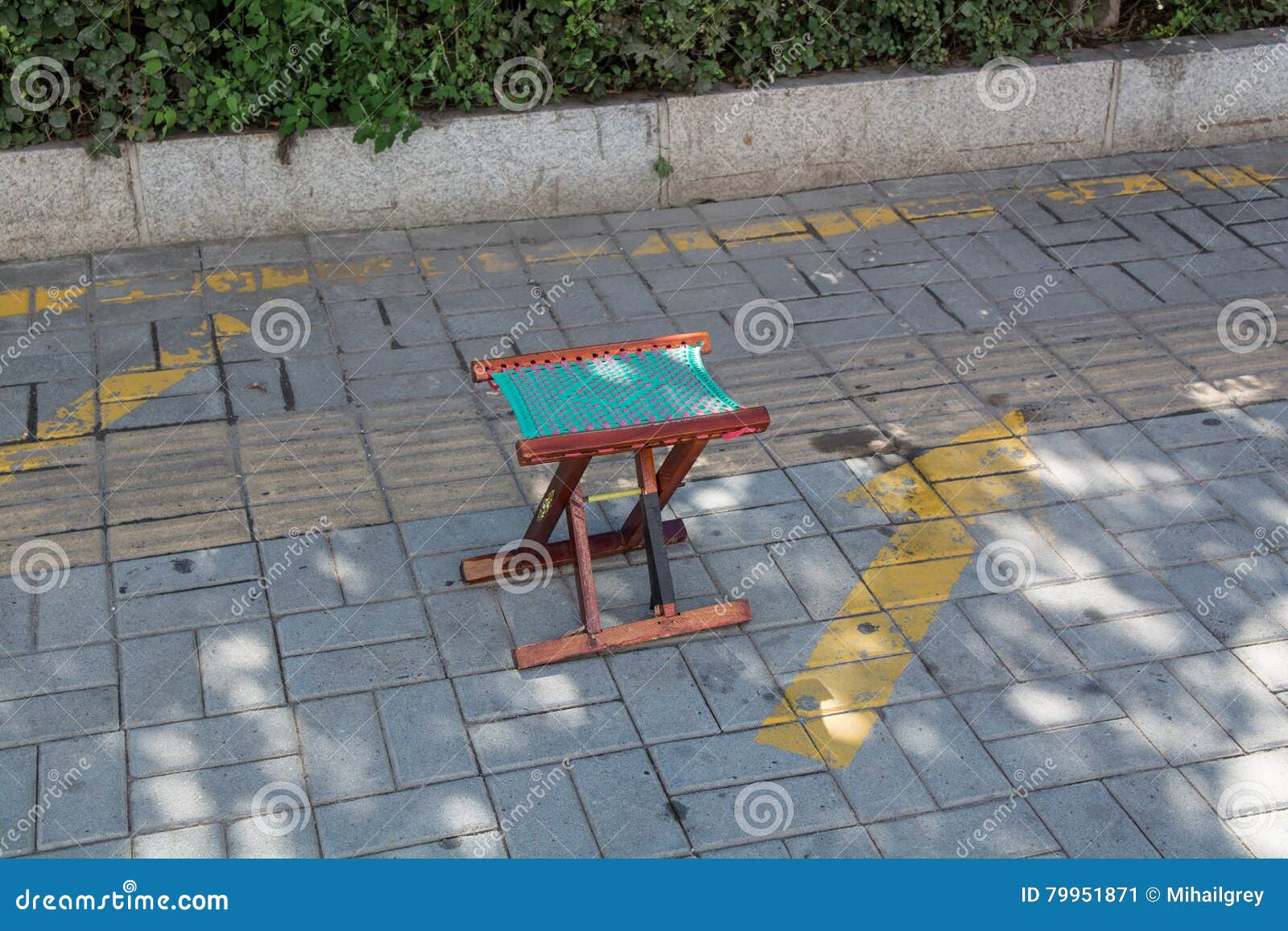 Small Wooden Folding Stool Stay Alone on a Pavement. Stock Image ...