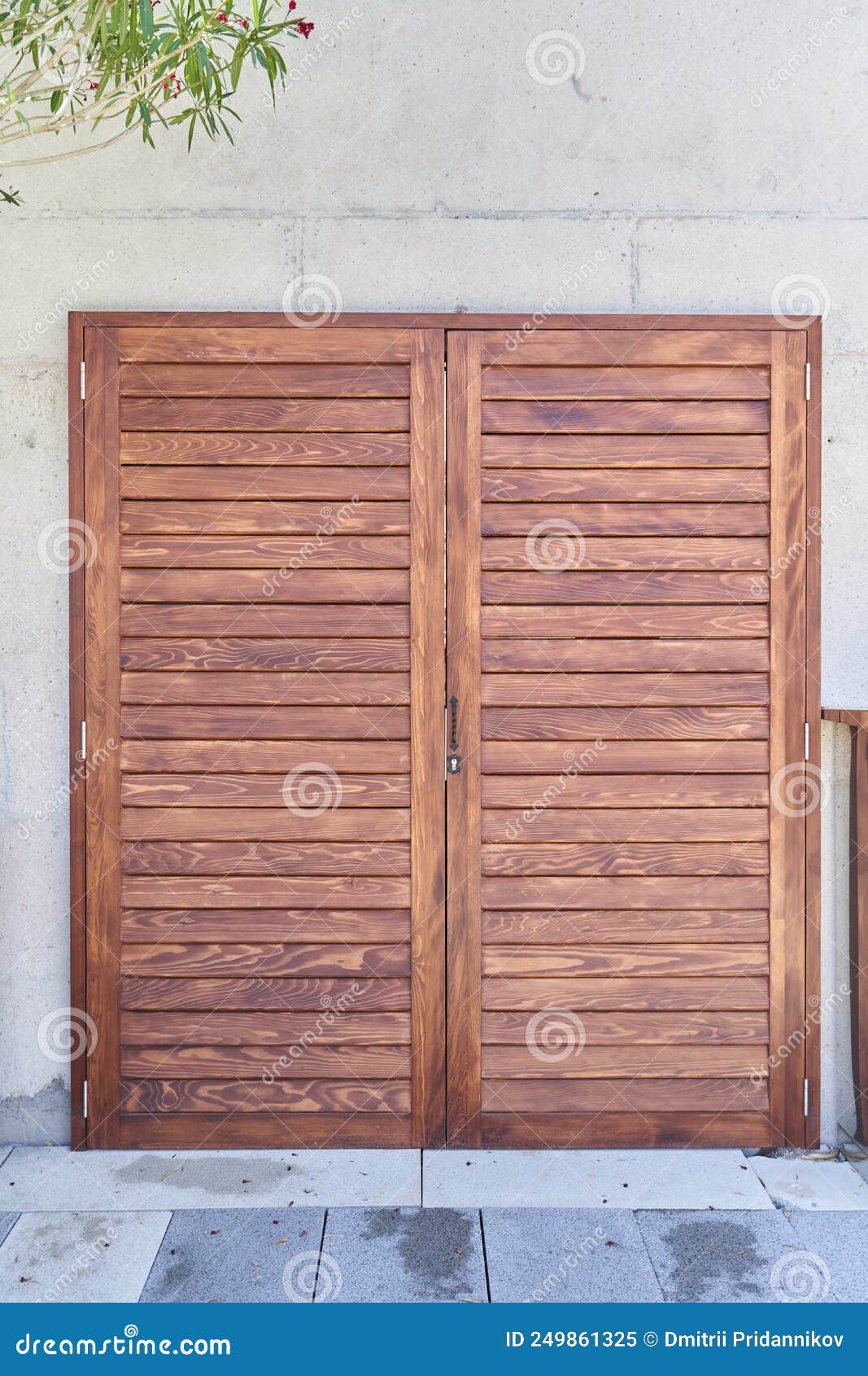 Small Wooden Louvered Doors on a Stone Wall Stock Image - Image of ...