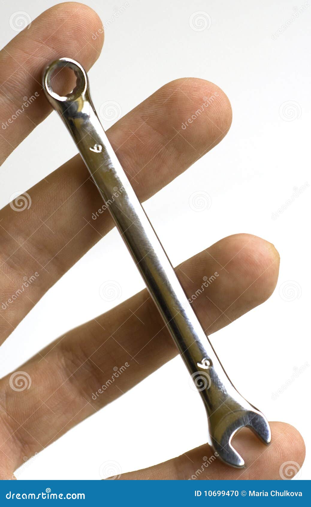 Small wrench on a hand stock photo. Image of wrench, effort - 10699470
