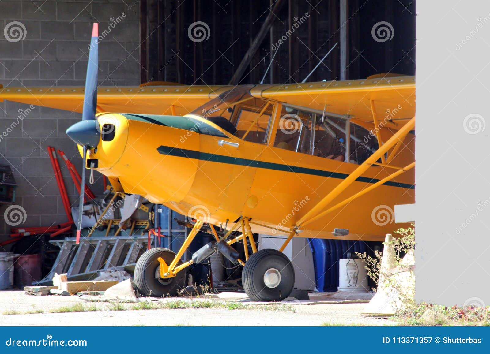 Small plane inside hangar stock image. Image of plane - 113371357