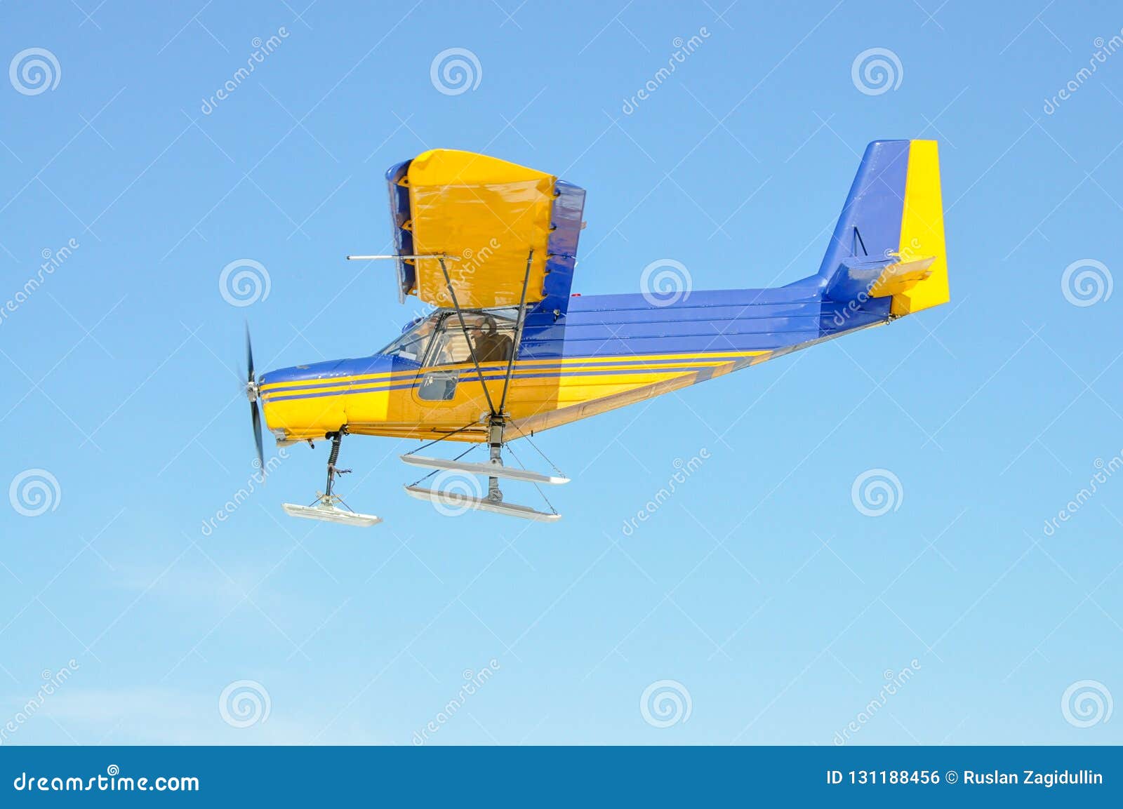 A Yellow Plane with a Propeller on the Blue Sky Editorial Photo - Image ...