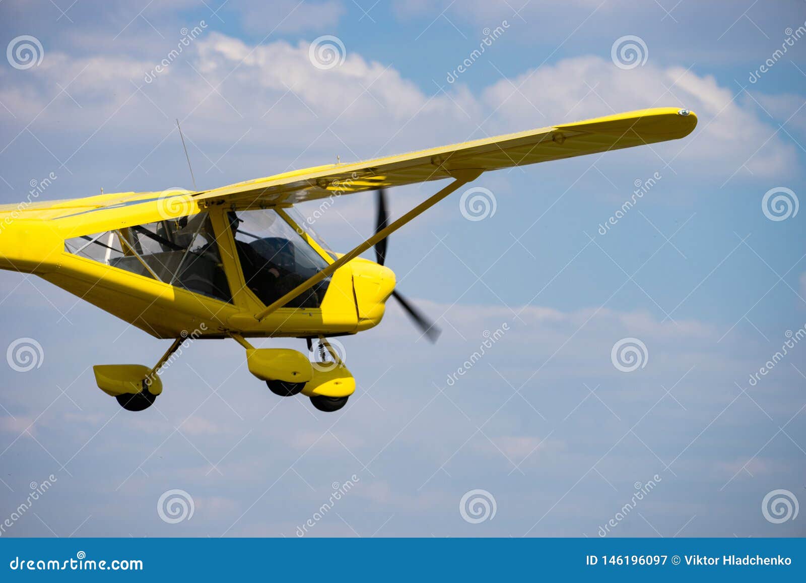 Small Yellow Private Aircraft Flying in a Blue Sky Stock Image - Image ...