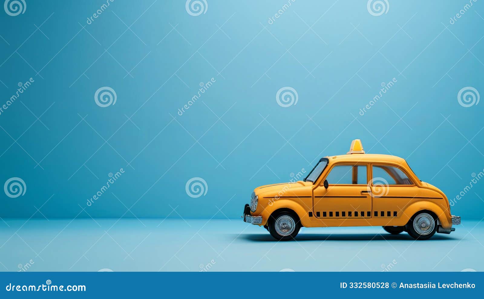 A Small Yellow Taxi Model , Blue Background with Copy Space Stock ...