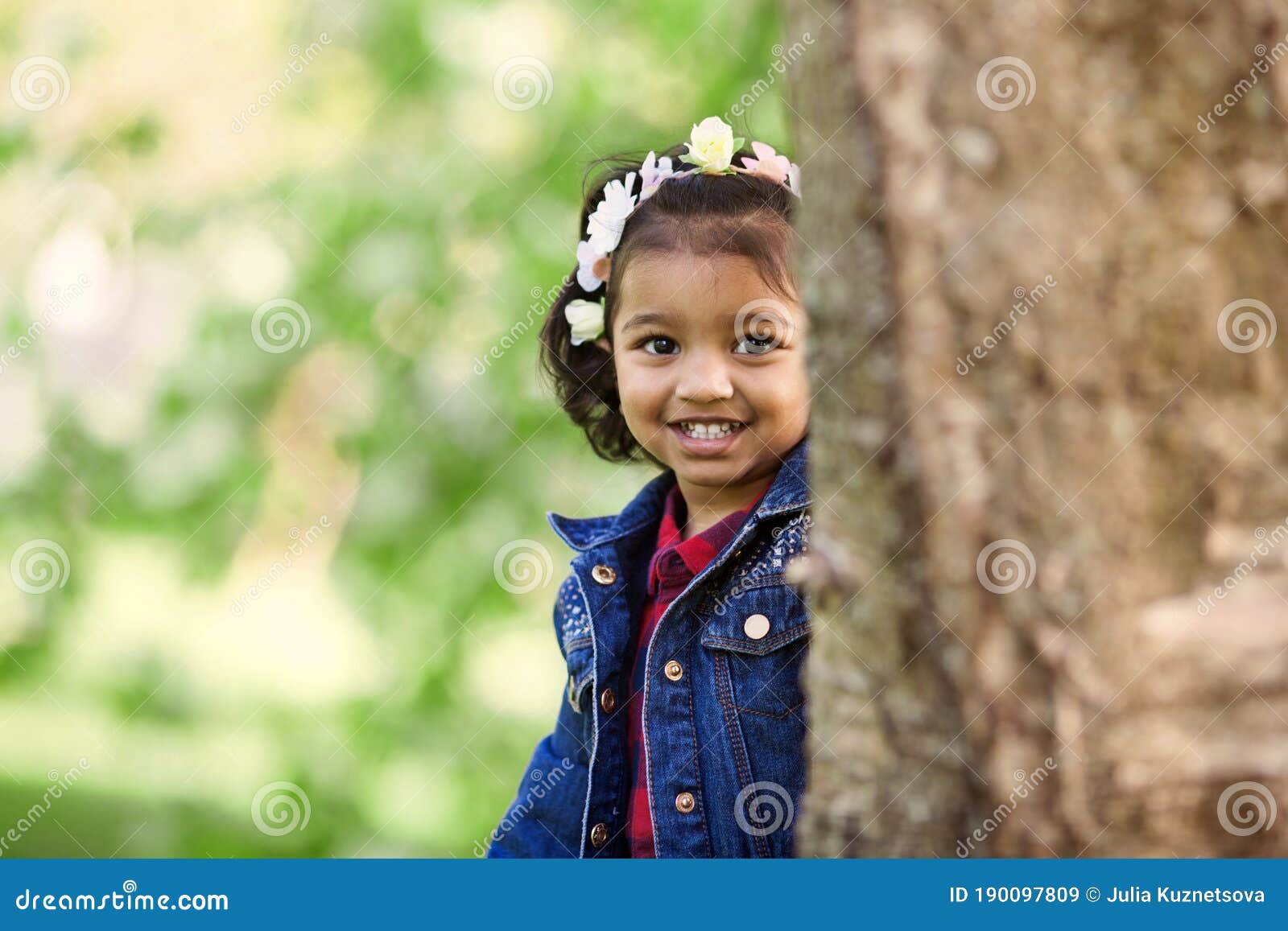 A Small Young Girl at Trunk of Big Tree in Park Stock Image - Image of ...
