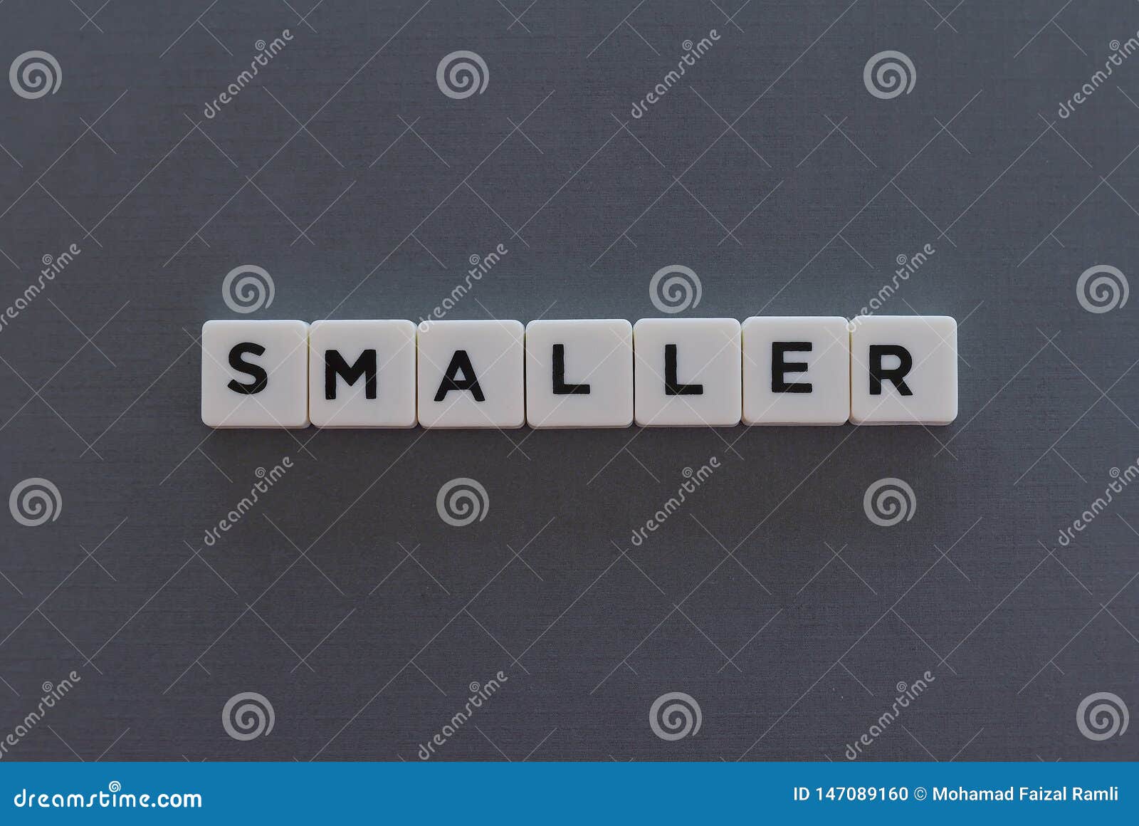 Smaller Word Made of Square Letter Word on Grey Background Stock Photo ...