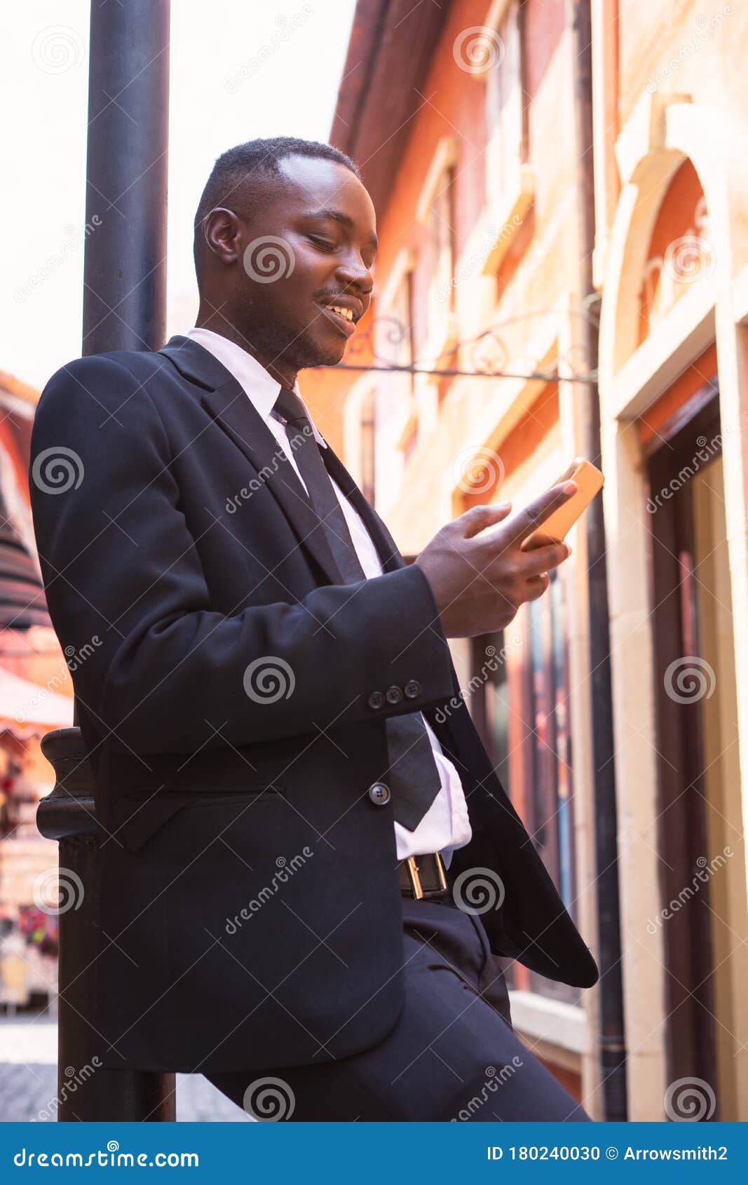 Smart African Business Man Standing and Using Smartphone in the City ...