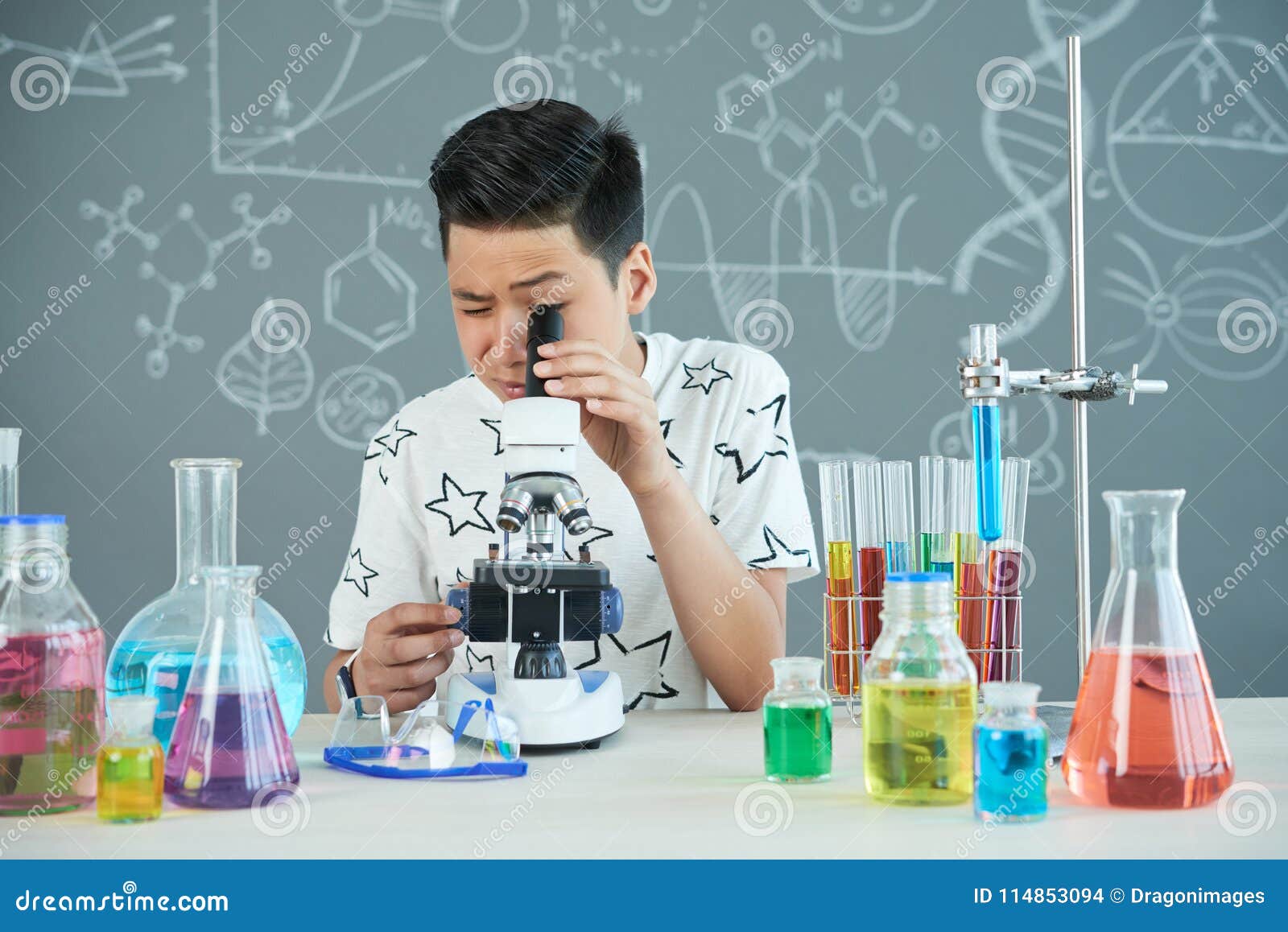 Handsome Pupil Using Microscope Stock Photo - Image of studying ...