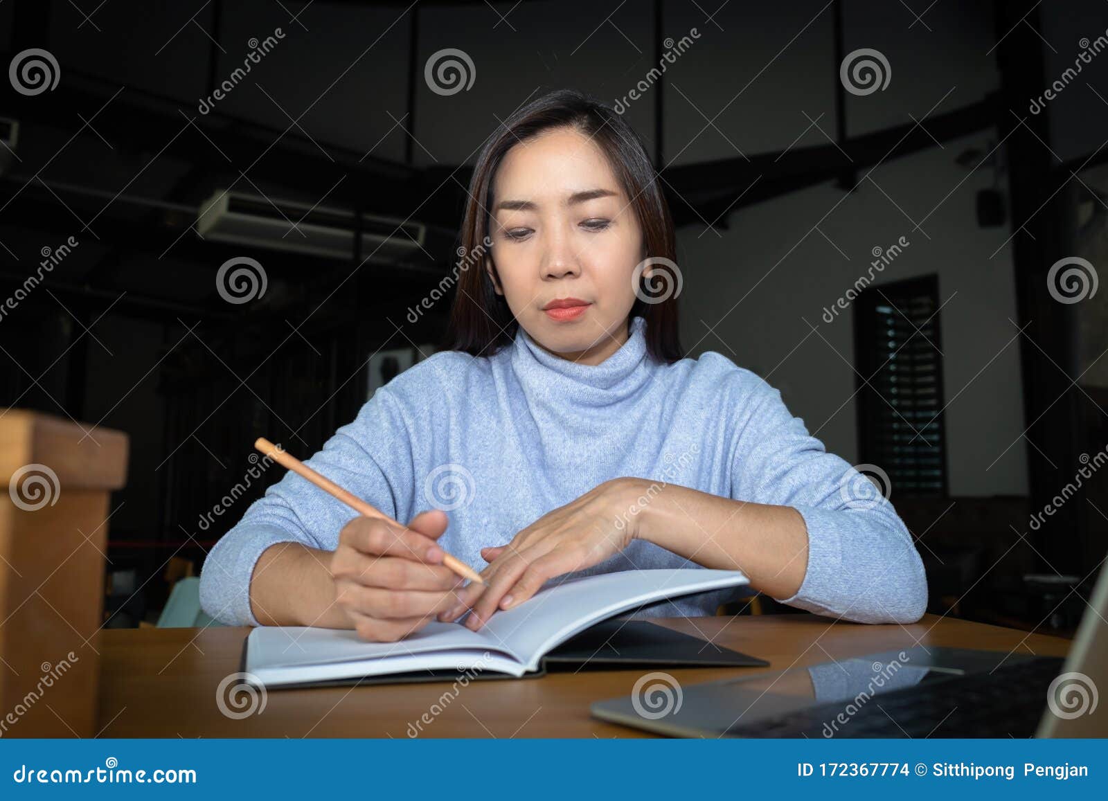 A Smart Beautiful Clever Asian Female Write and Note Down Information ...