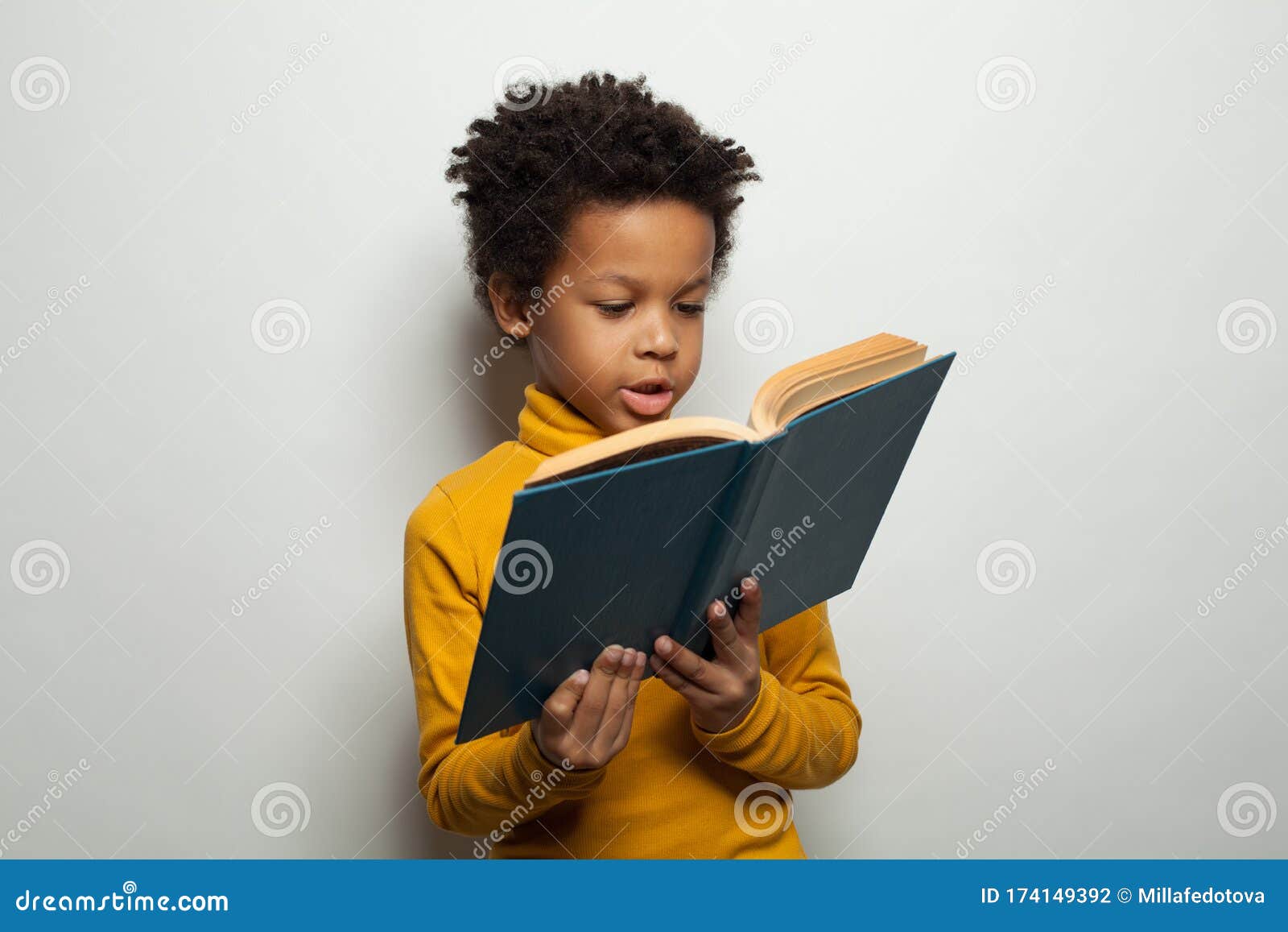Smart Black Child Boy Reading A Book On White Background Royalty-Free ...