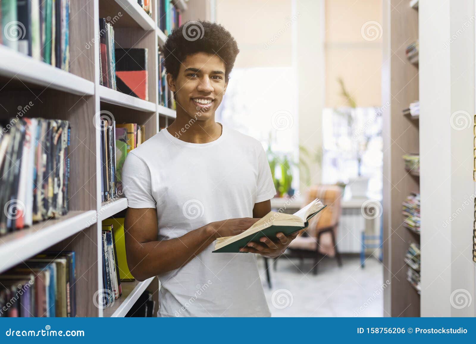 Smart Black Guy Checking on Information in Handbook Stock Photo - Image ...