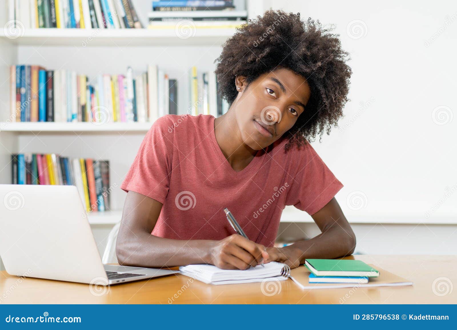 Smart Black Male Student Learning with Books and Computer Stock Photo ...