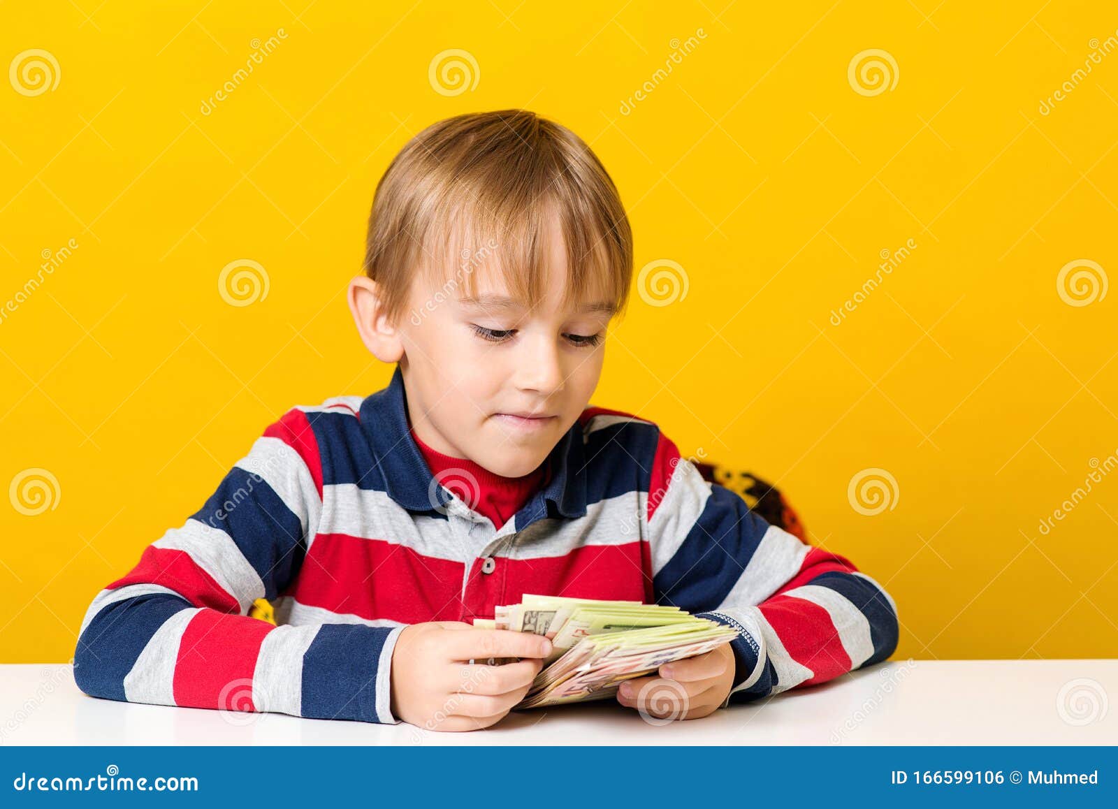 Smart Boy Counting Money at Table. Finance Education Stock Photo ...