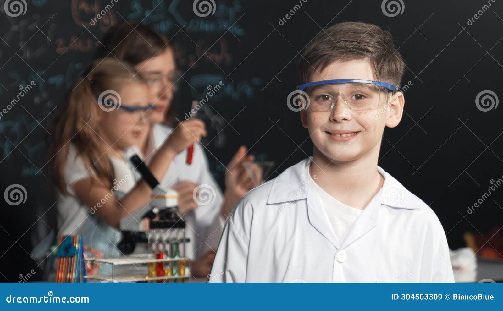 Smart Boy Crossing Arms while Teacher and Frien Doing Experiment ...