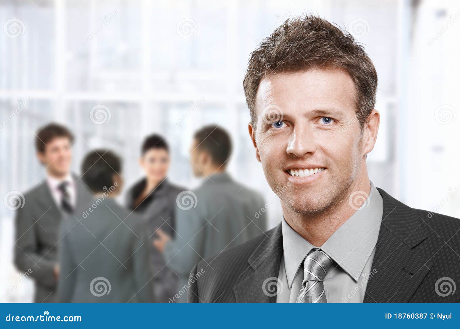 Smart businessman smiling stock image. Image of businesspeople - 18760387