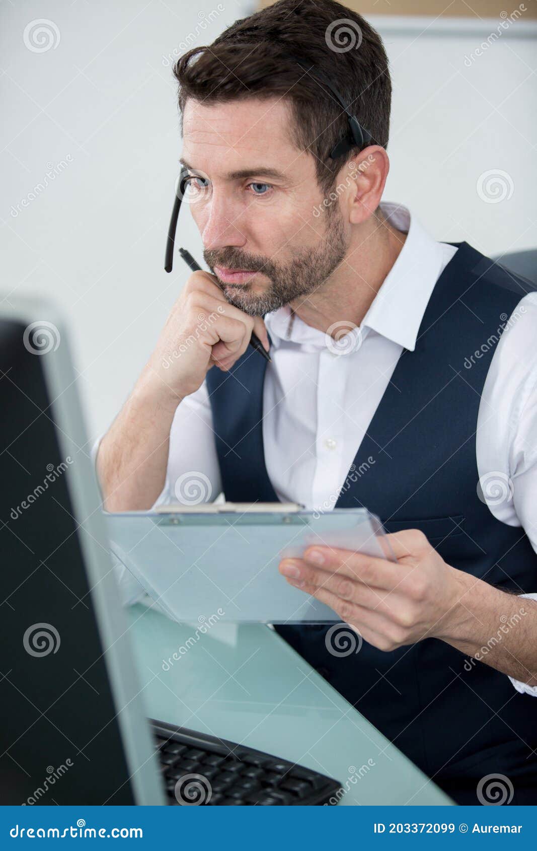 Smart Businessman in White Shirt Verifying Information from Paper Stock ...